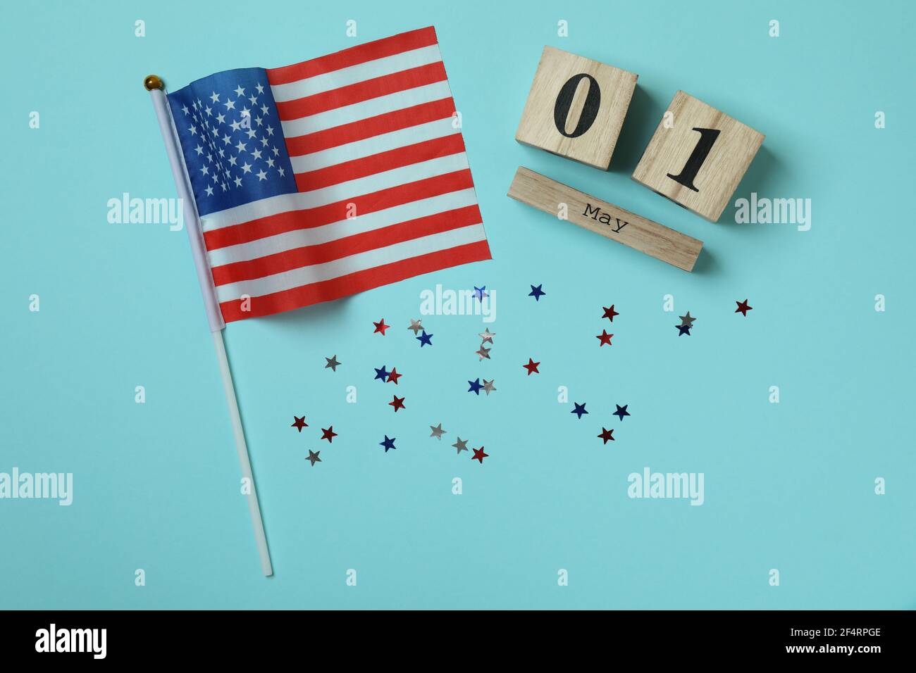 Wooden calendar with 1 may, glitter and American flag on blue ...