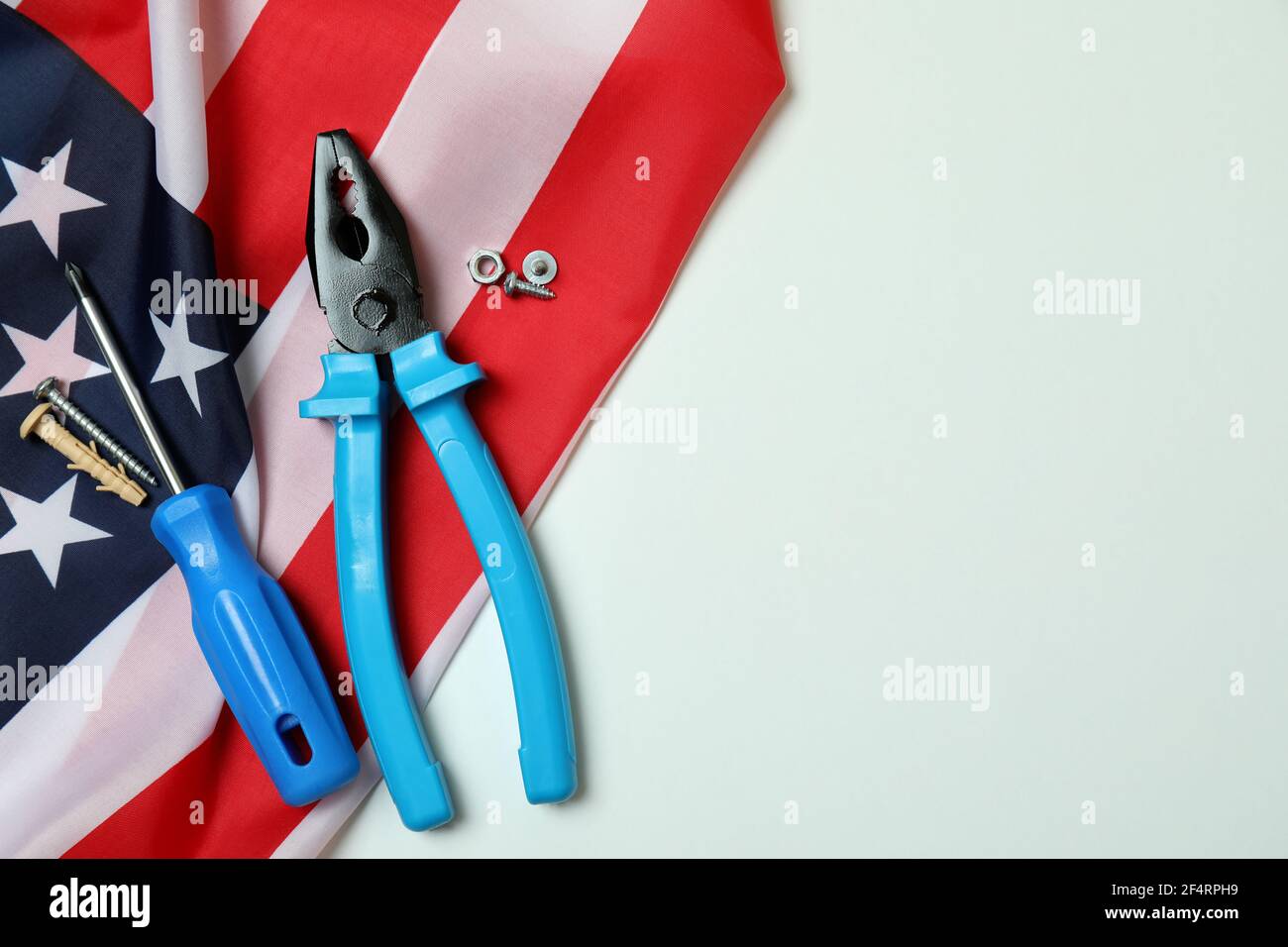 American flag and tools on white background Stock Photo - Alamy