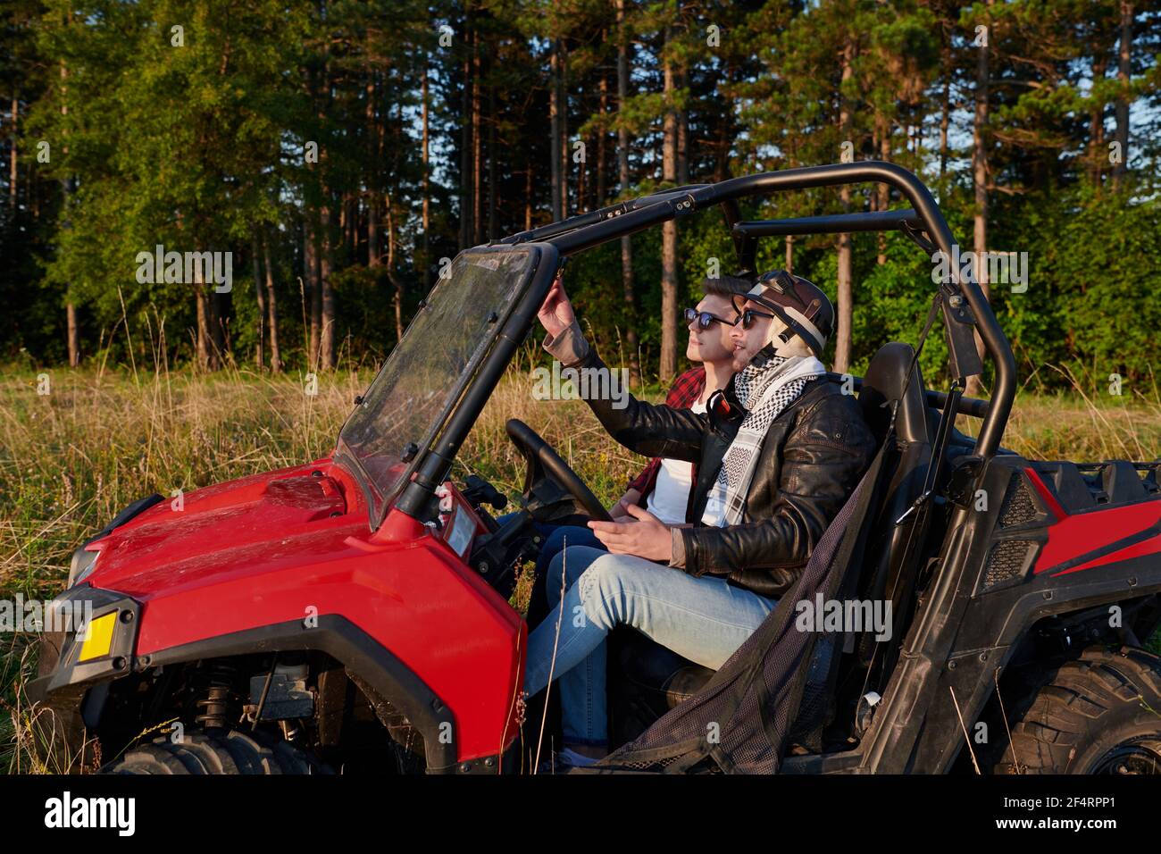 two young happy excited men enjoying beautiful sunny day while driving ...