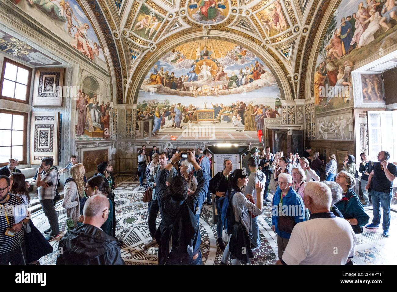 Vatican - Oct 06, 2018: Tourists enjoy painting in Raphael Stanzas ...