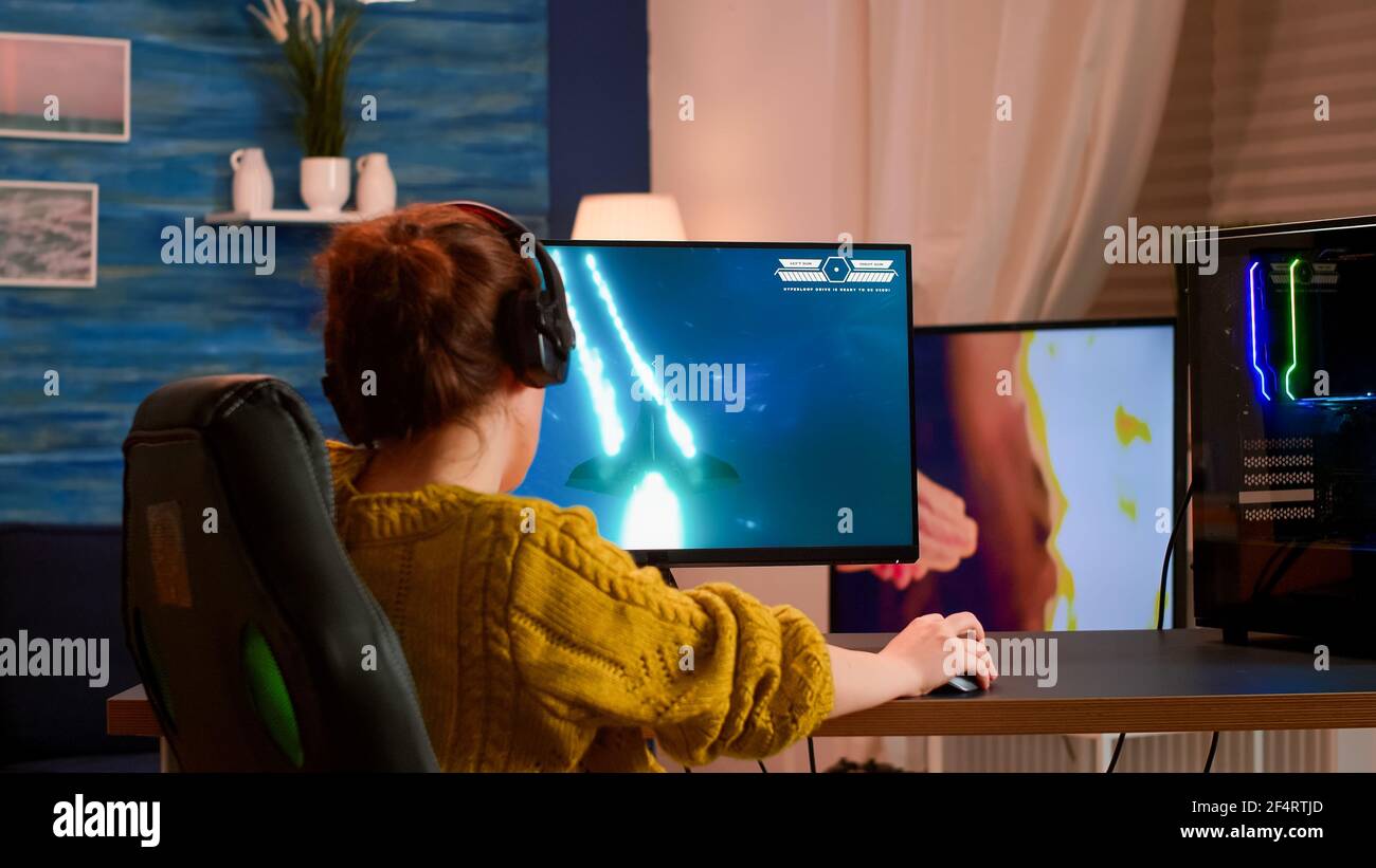 Virtual shooter game in cyberspace, esports player performing on pc ...