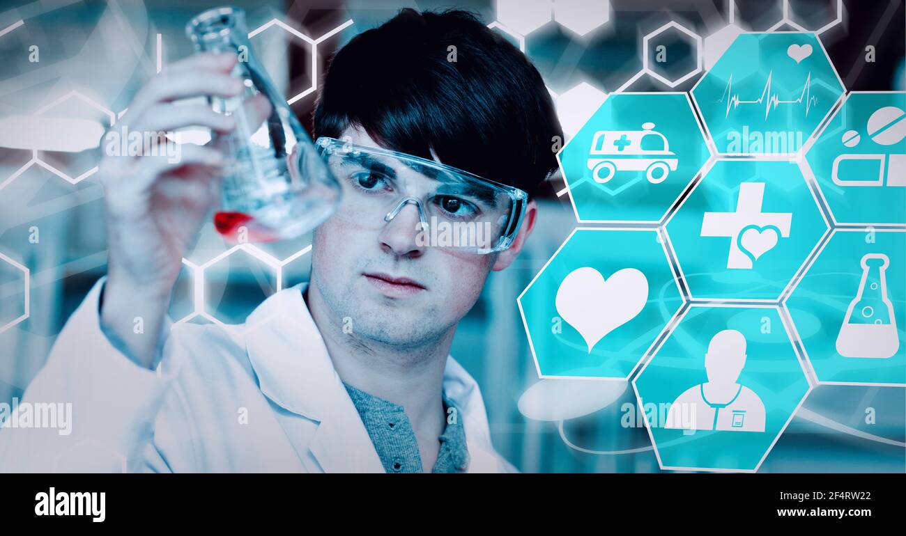 Multiple medical icons against male caucasian health worker working at ...