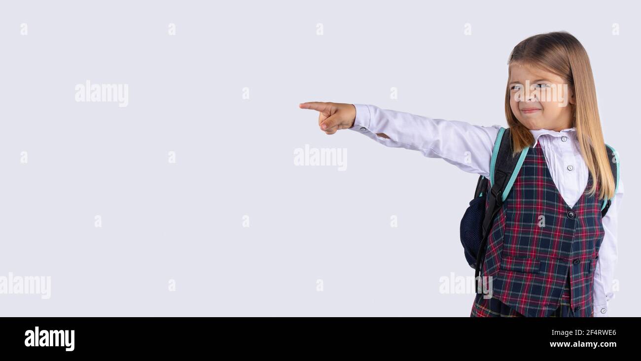 Banner, long format, grey background. Upset schoolgirl pointing her ...