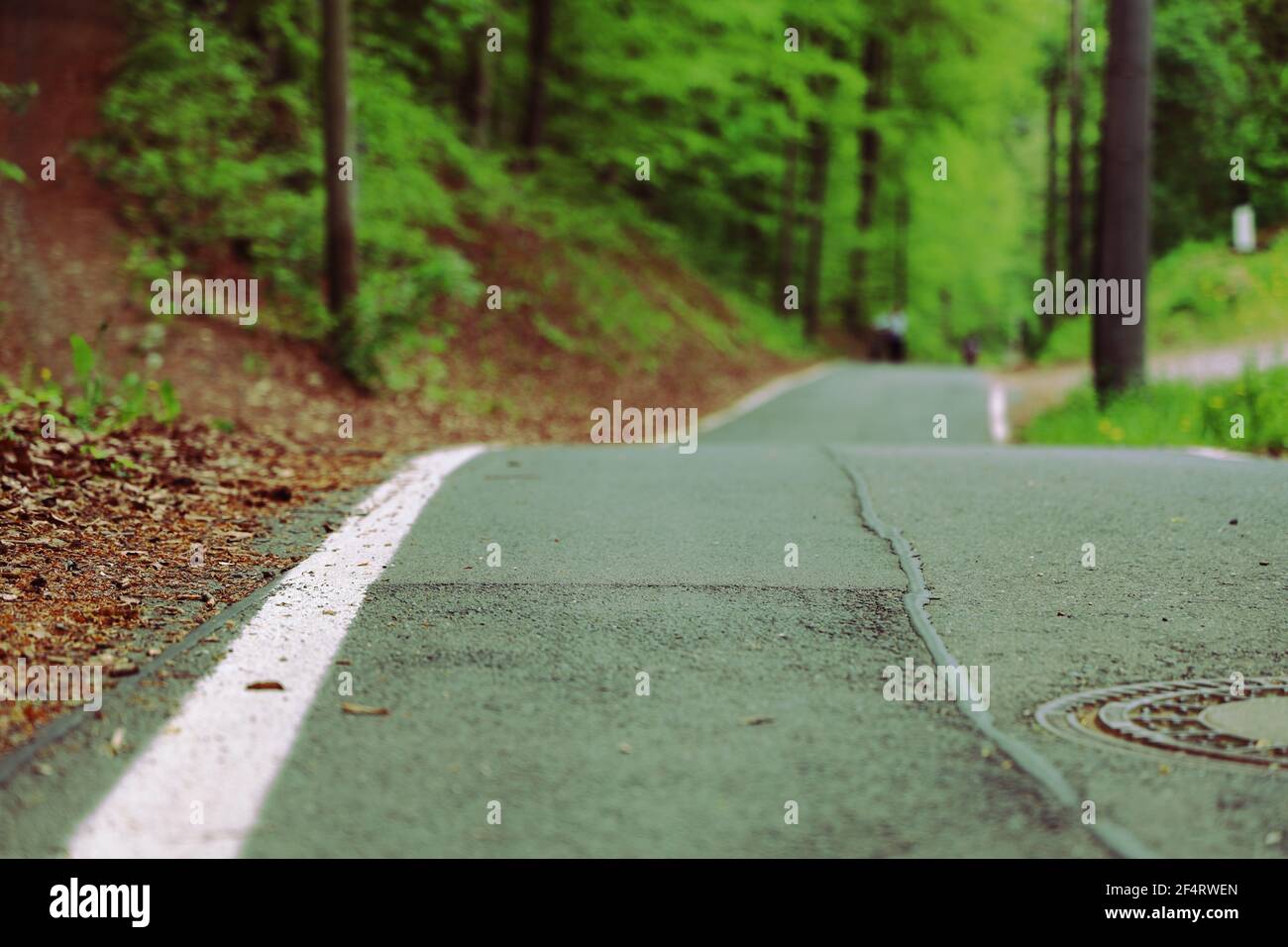 Small road up a hill Stock Photo - Alamy