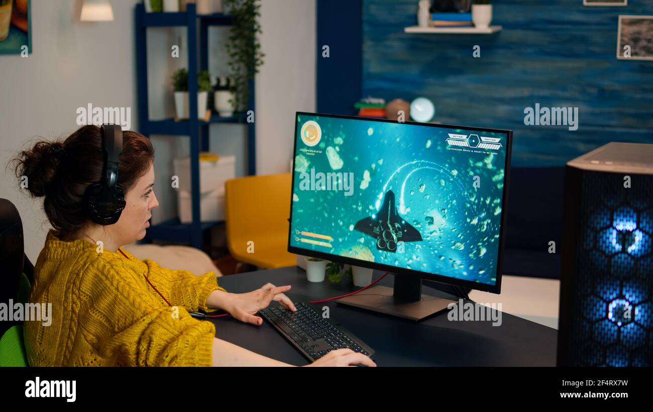 Professional eSports woman playing cyber video games on modern powerful ...