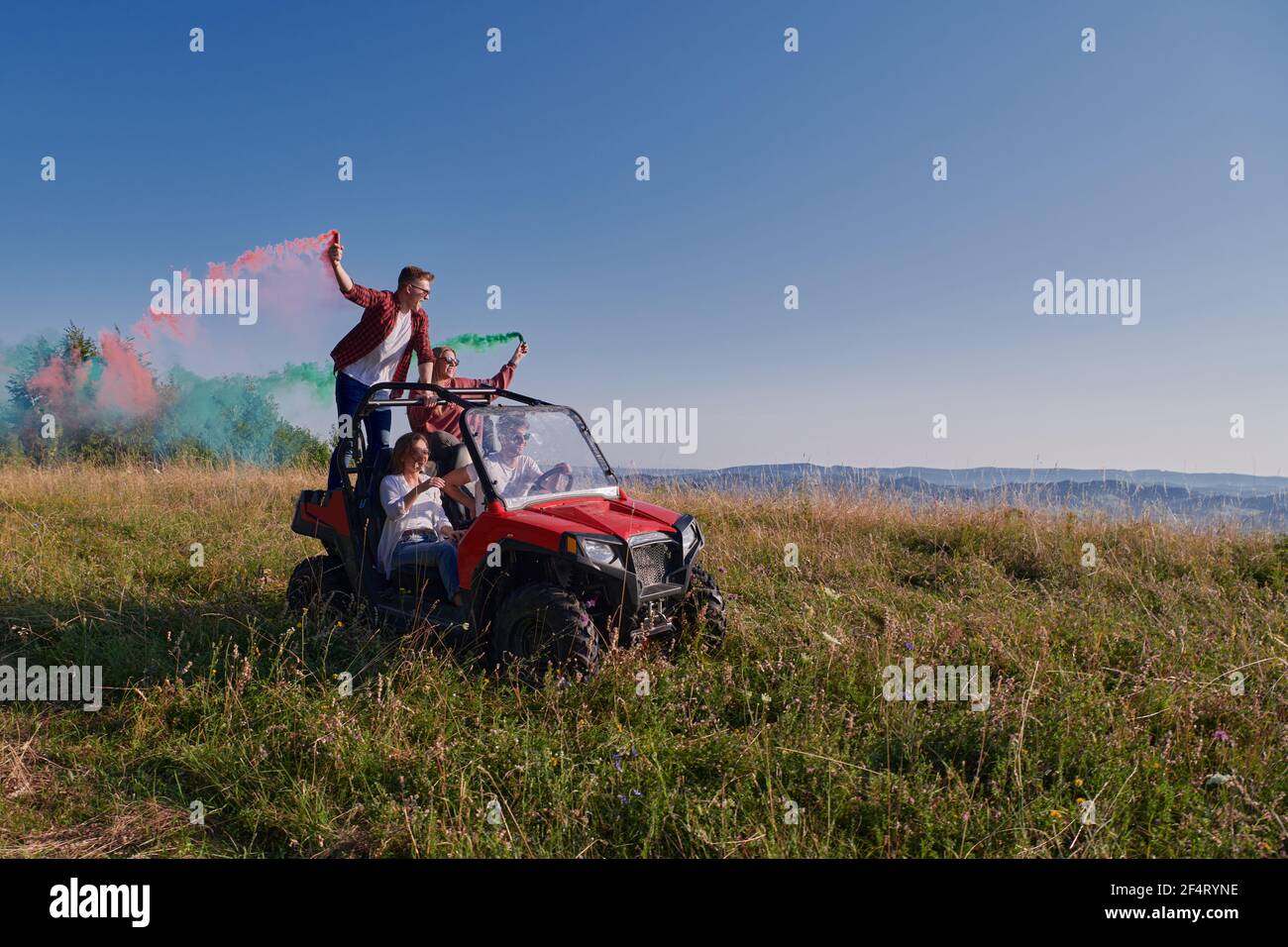 colorful torches while driving a off road buggy car Stock Photo - Alamy