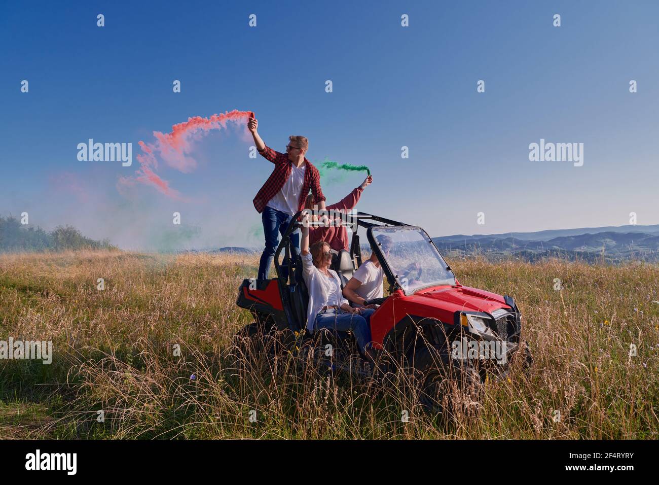 colorful torches while driving a off road buggy car Stock Photo - Alamy
