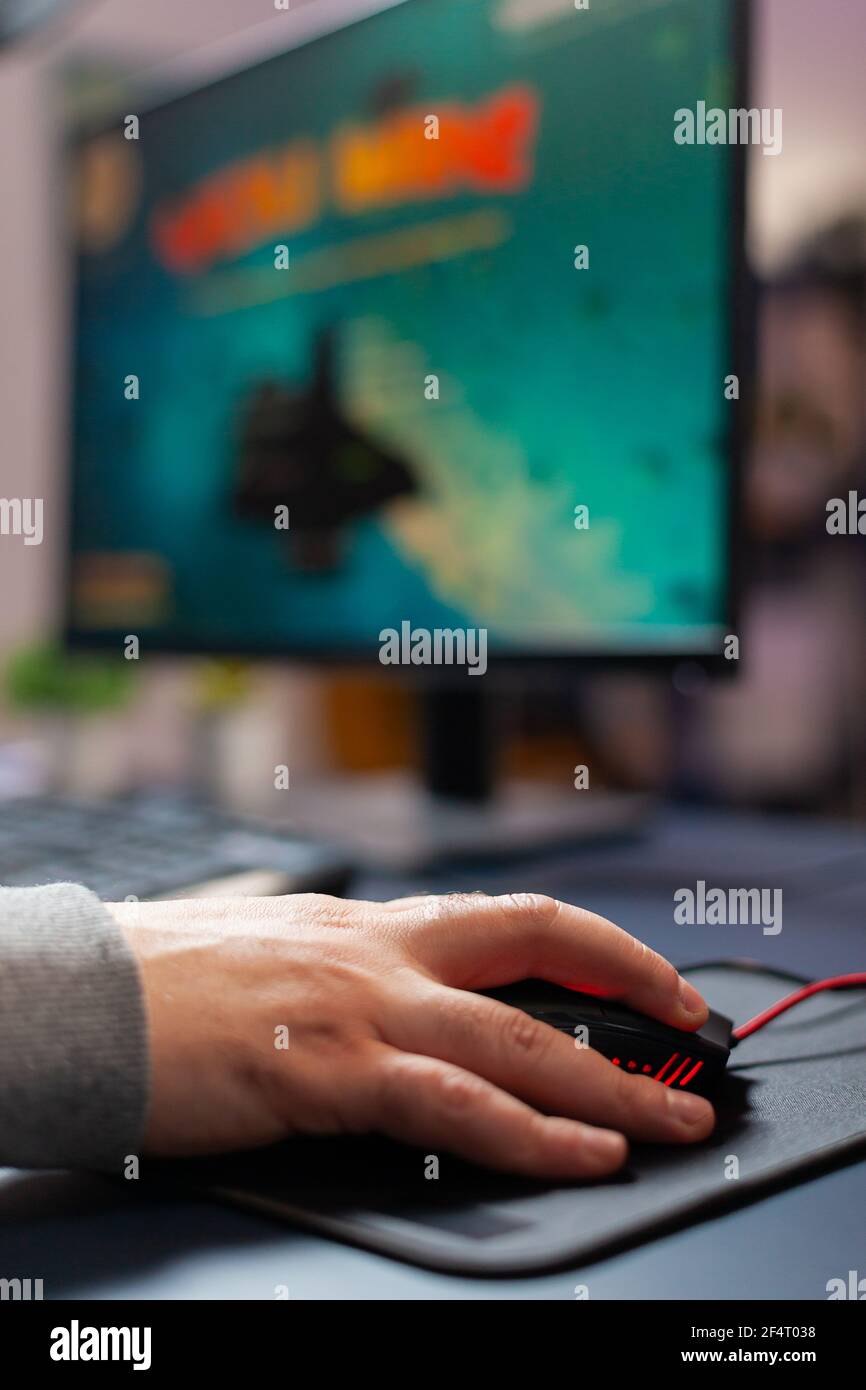 Close up hand of pro gamer in home studio using professional mouse ...