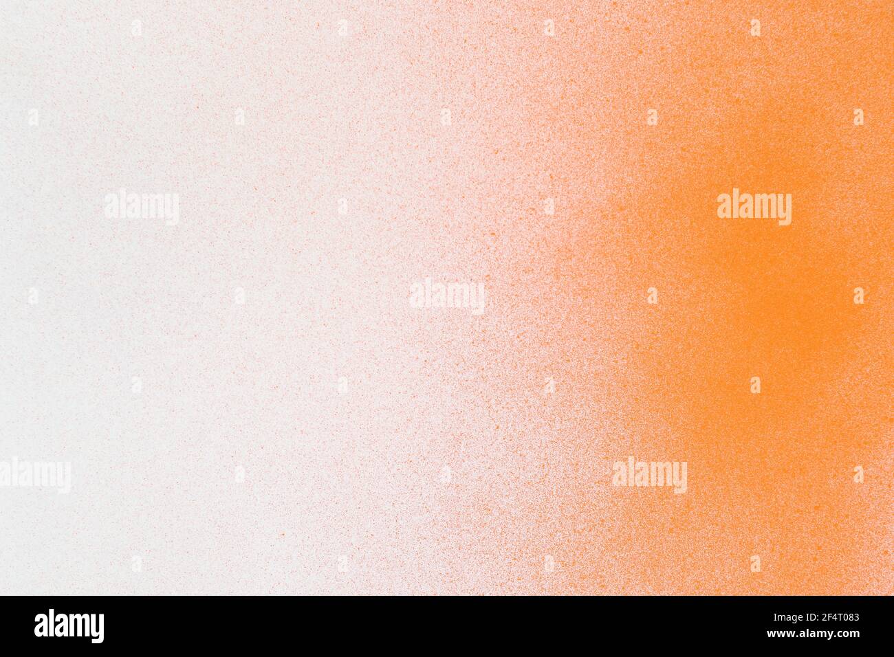 spray paint orange on a white paper background Stock Photo - Alamy