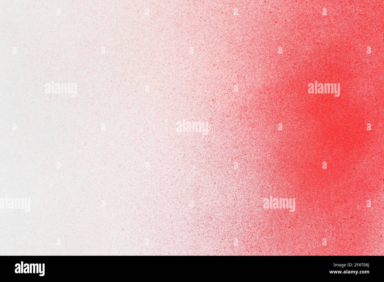 spray paint red on a white paper background Stock Photo - Alamy