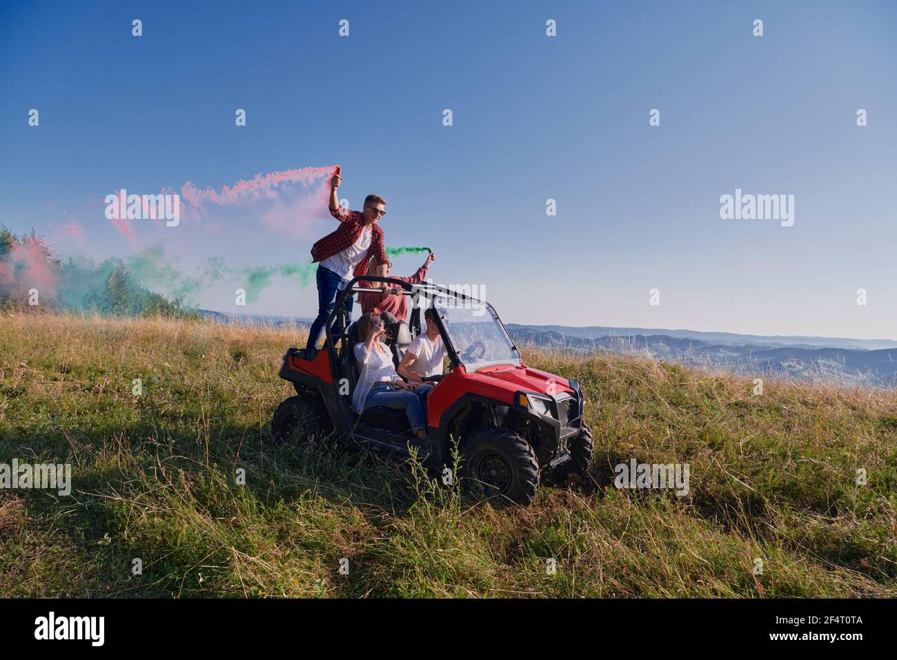 colorful torches while driving a off road buggy car Stock Photo - Alamy