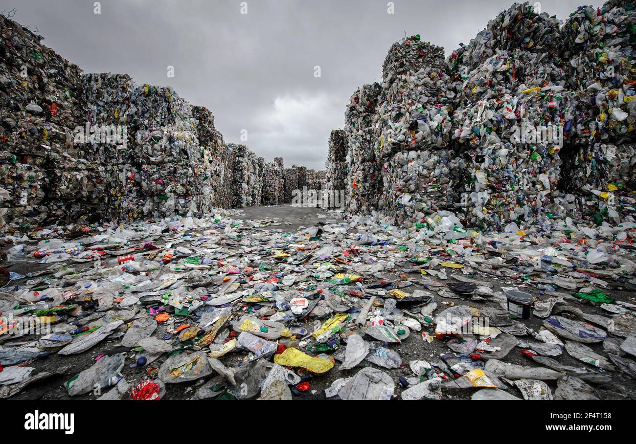 Bales of plastic waste at a materials recycling facility in the UK ...