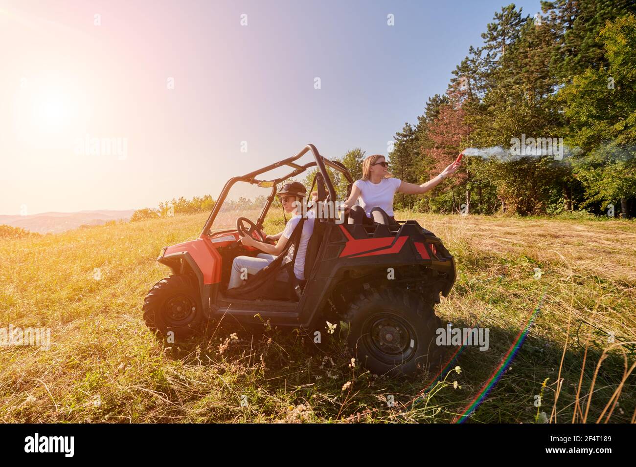 colorful torches while driving a off road buggy car Stock Photo - Alamy
