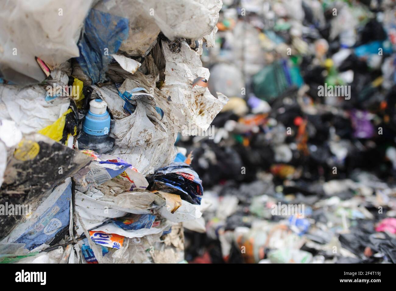 Bales of plastic waste at a materials recycling facility in the UK ...