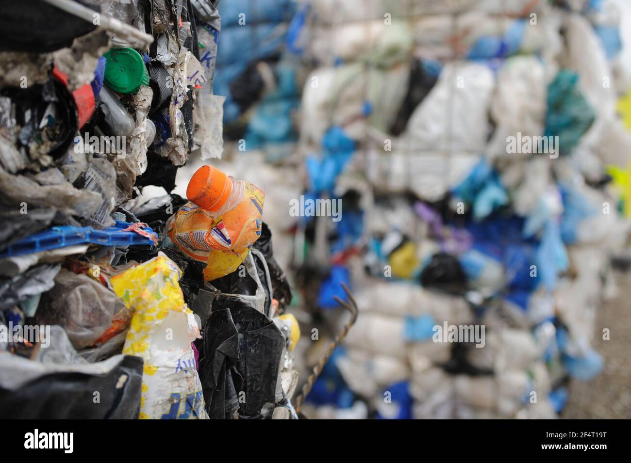 Bales of plastic waste at a materials recycling facility in the UK ...