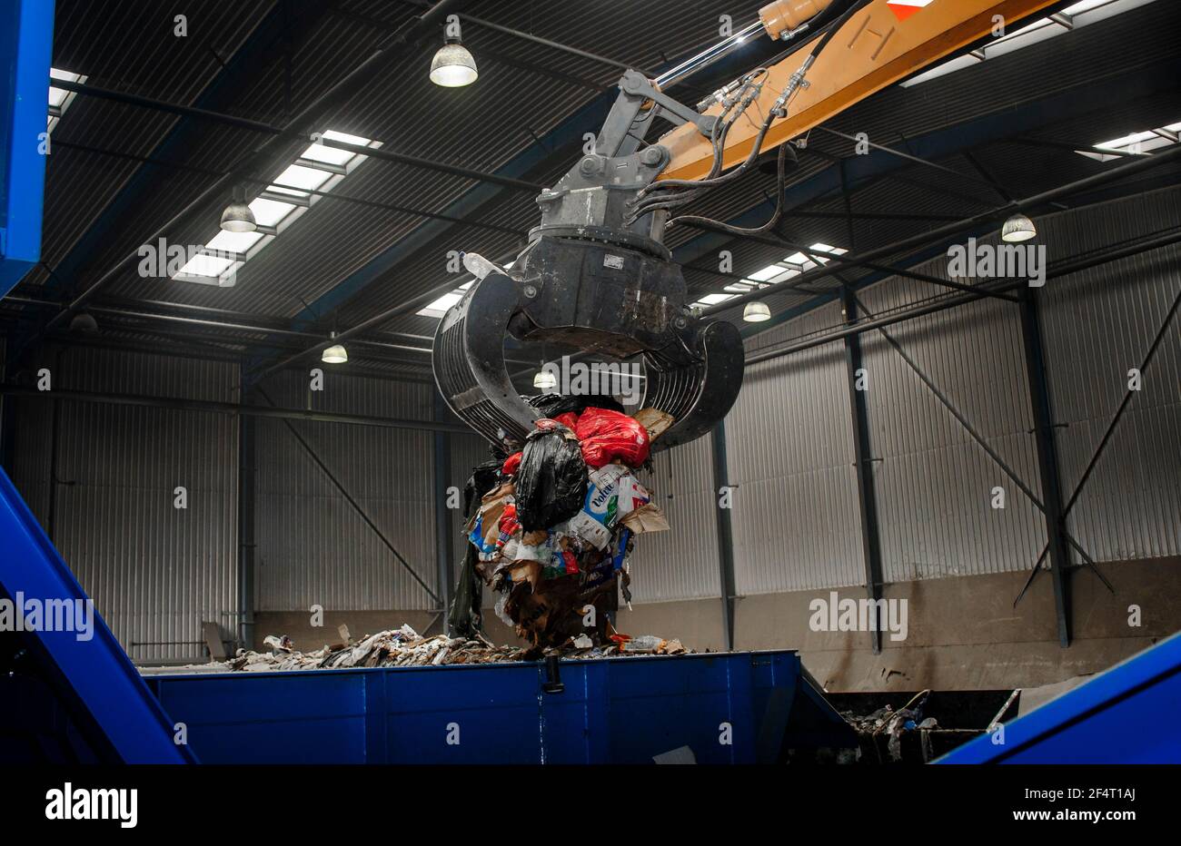 Mechanical grabber at work in a recycling plant in England Stock Photo ...