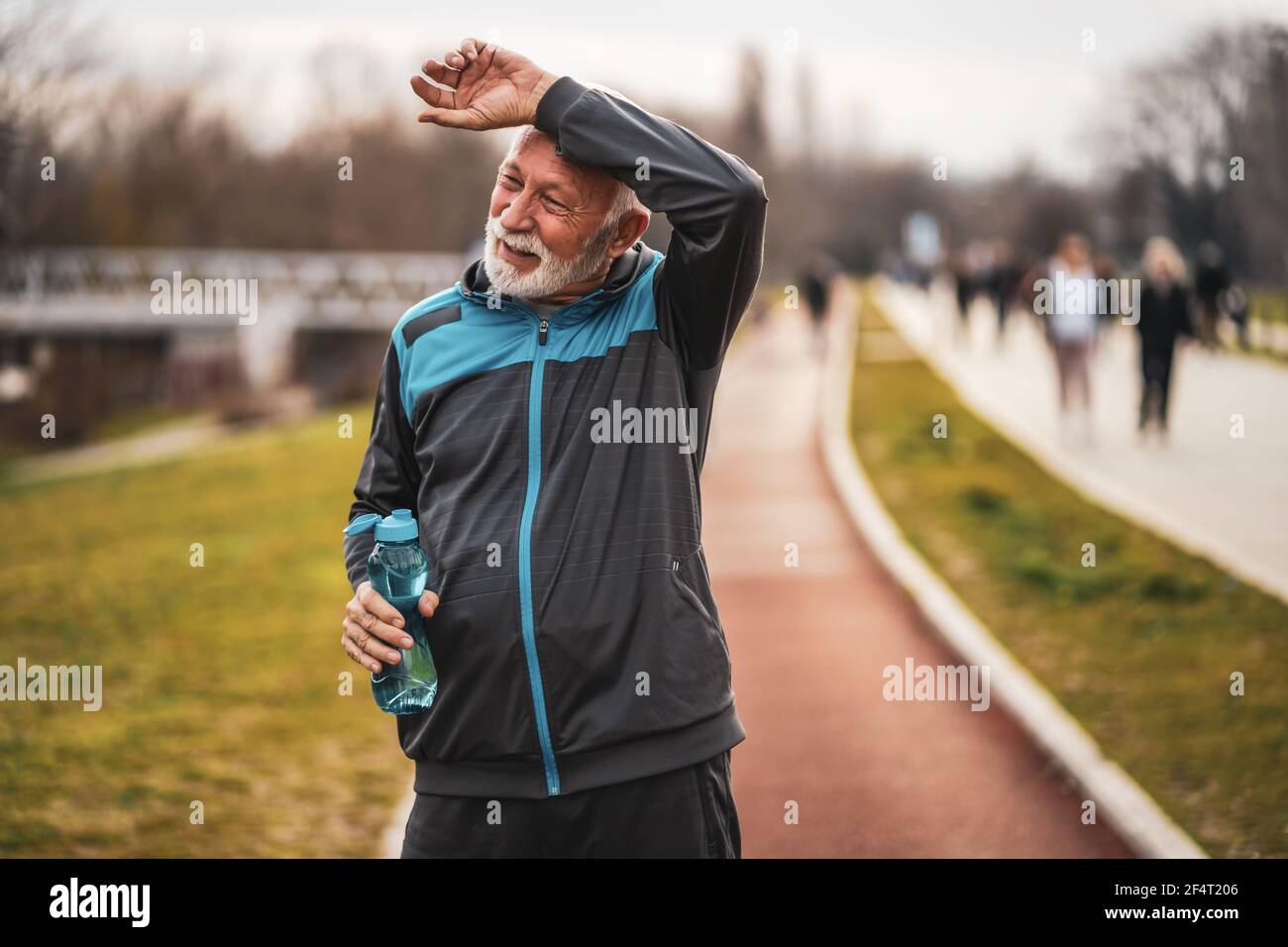 Active senior man is tired after exercising. Healthy retirement ...