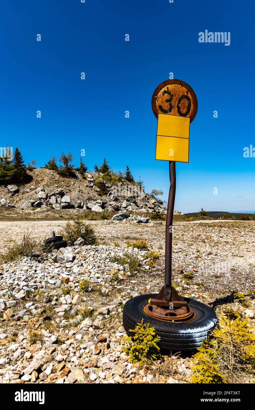 Old rusty 30 speed limit sign on steel pipe in old quartz mine ...