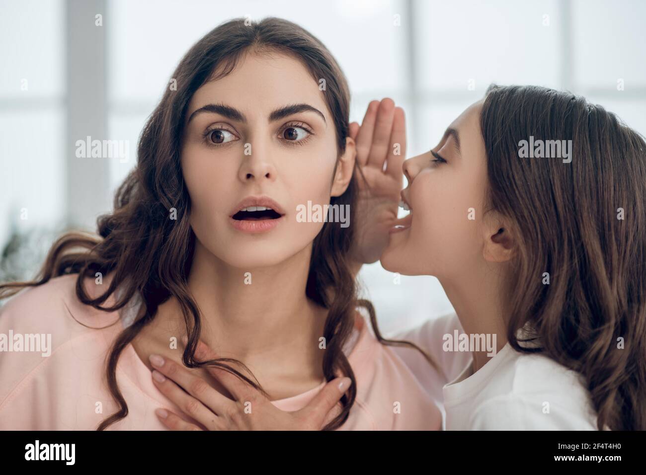 Whisper in ear hi-res stock photography and images - Alamy