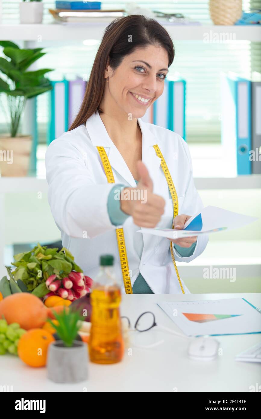 weight loss concept young dietitian in her office Stock Photo - Alamy