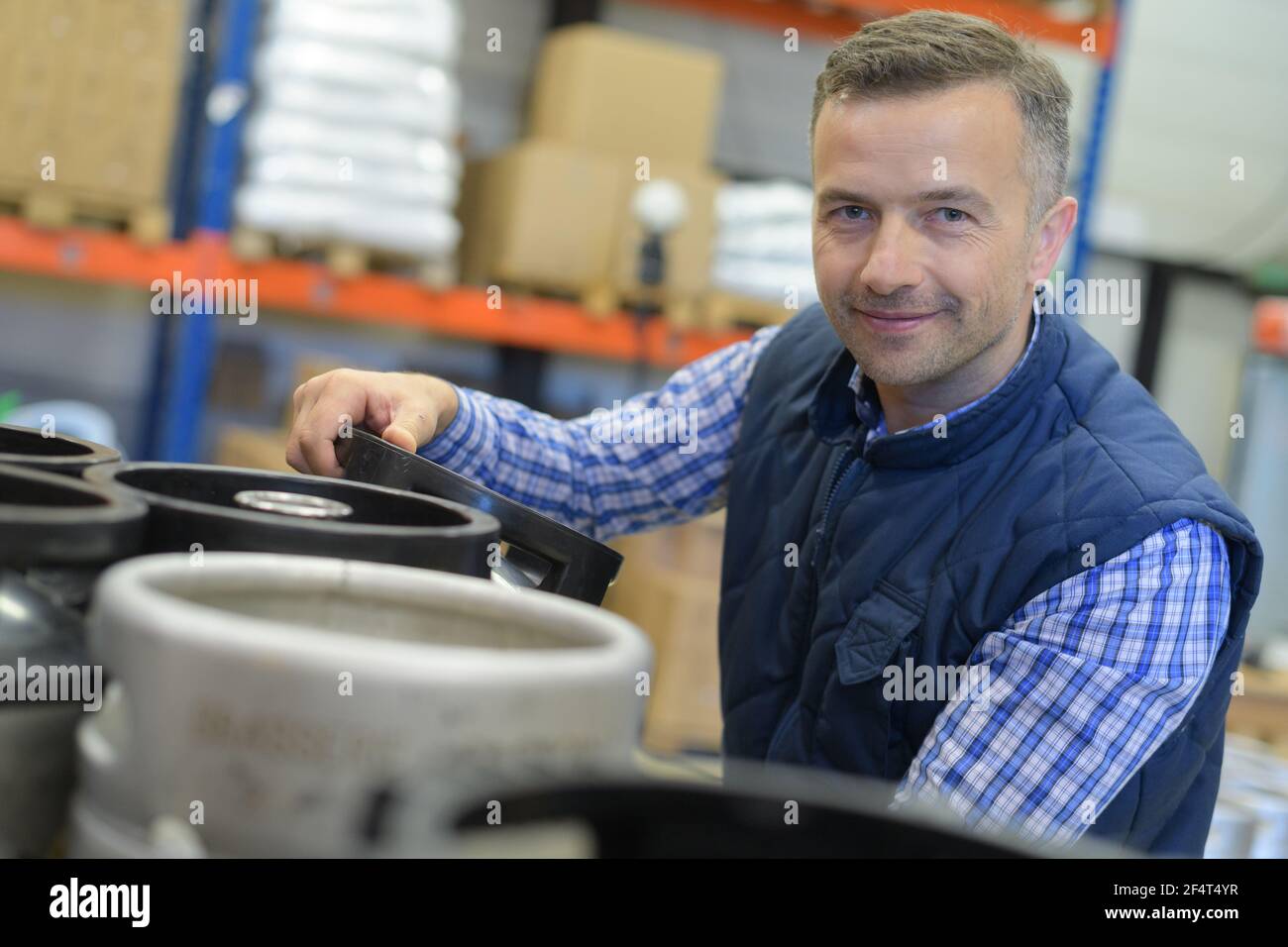 man working at a warehouse Stock Photo - Alamy