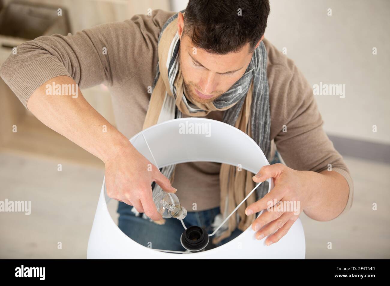 Changing a light bulb hi-res stock photography and images - Alamy