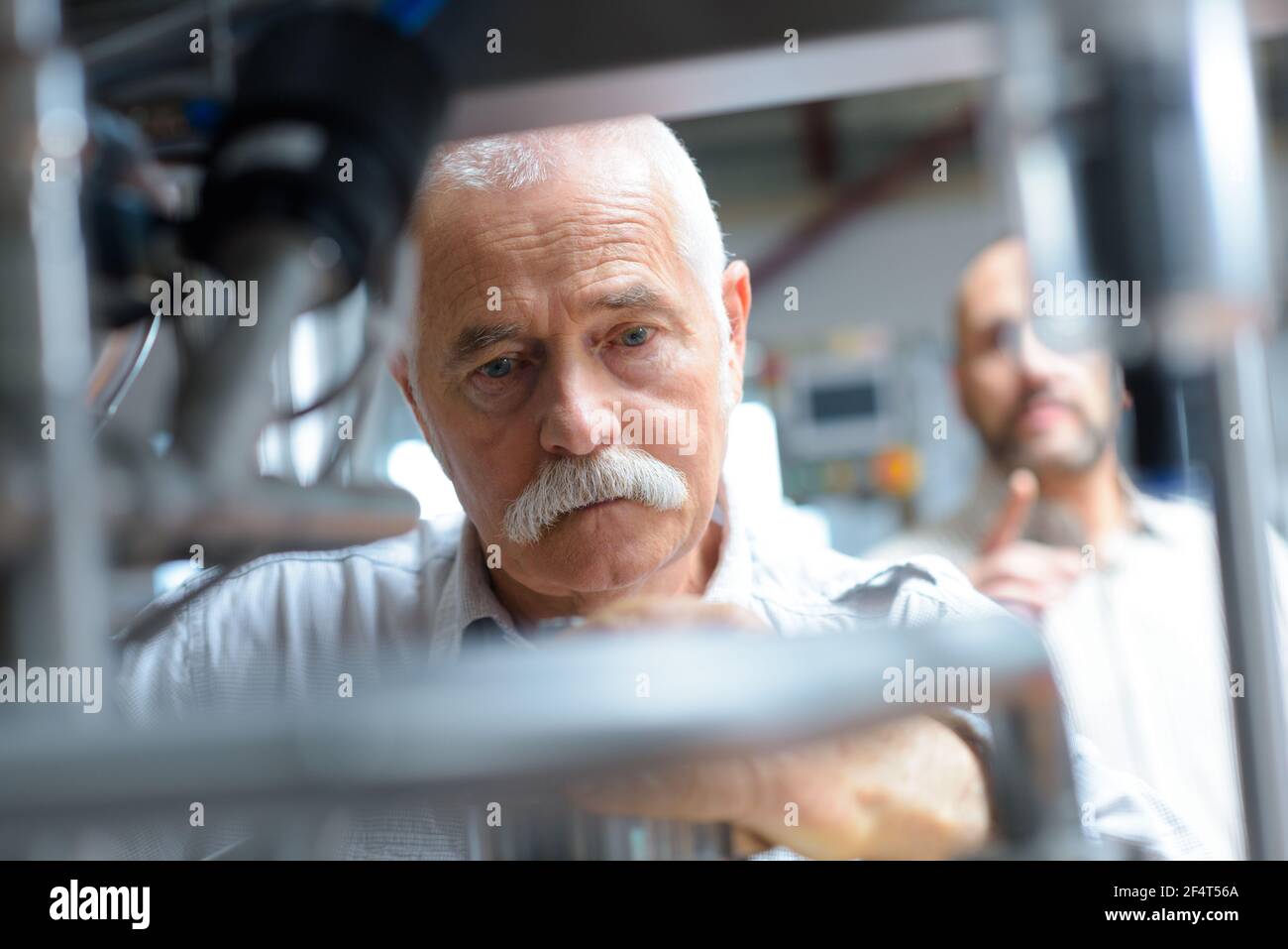 portrait of senior factory worker Stock Photo - Alamy