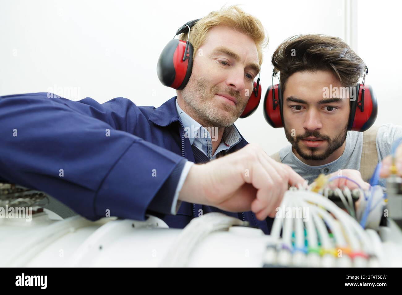 two workers in a workshop Stock Photo - Alamy