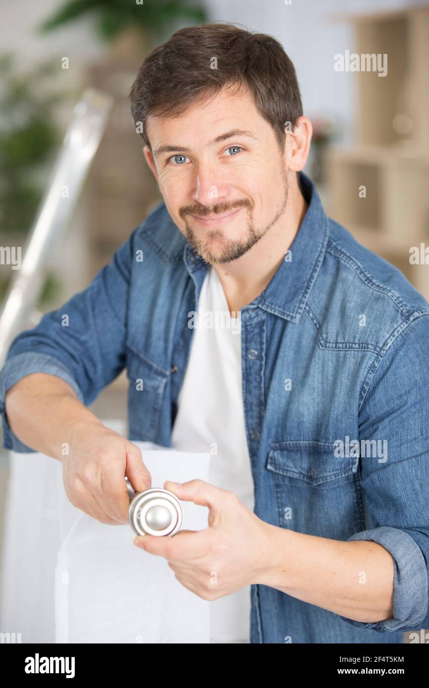 man preparing to mount a curtain rail Stock Photo - Alamy
