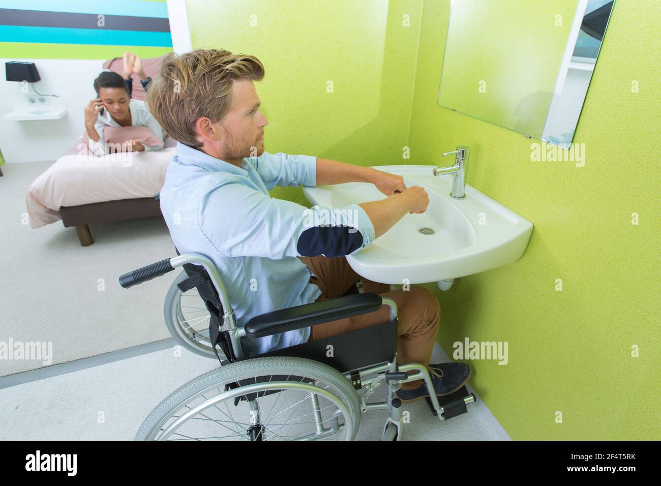 Disabled man in bathroom washing hi-res stock photography and images ...