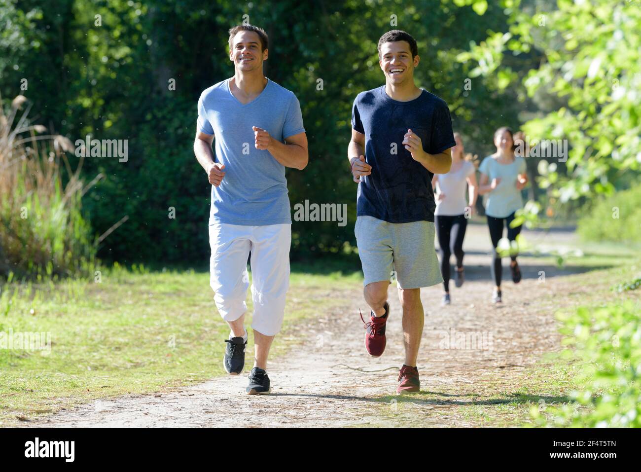 two men friends jogging outdoors Stock Photo - Alamy