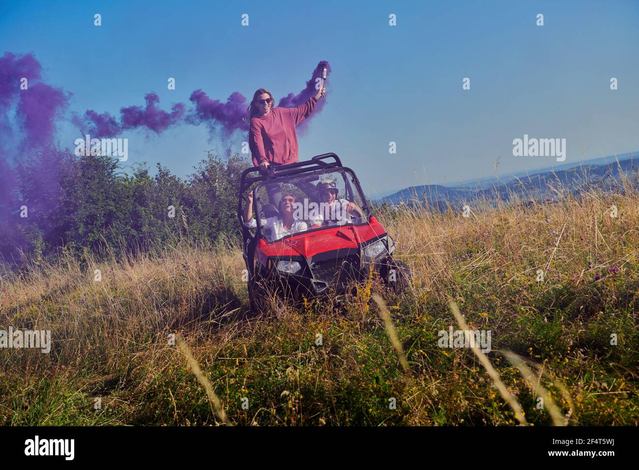colorful torches while driving a off road buggy car Stock Photo - Alamy