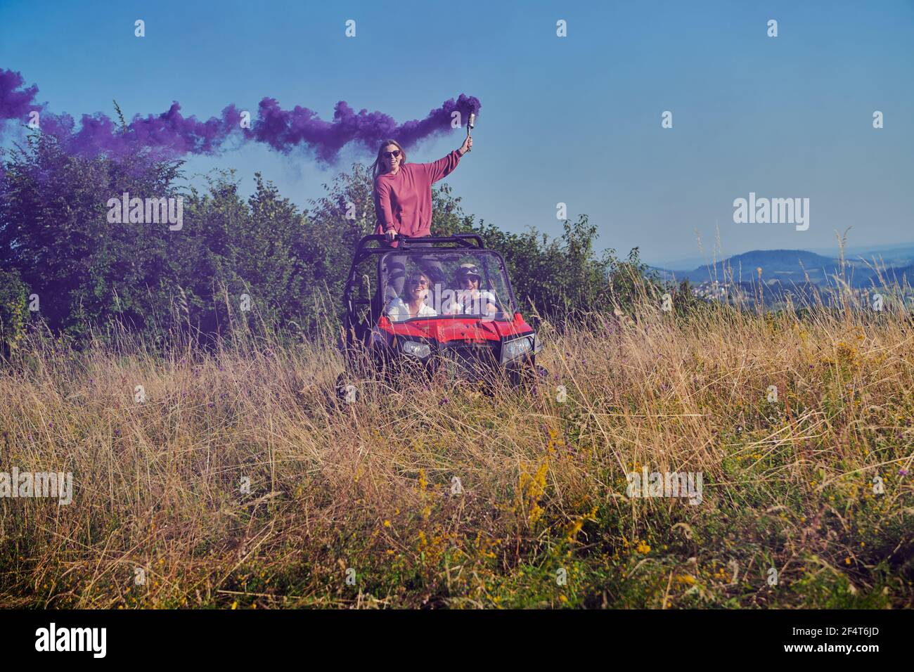 colorful torches while driving a off road buggy car Stock Photo - Alamy