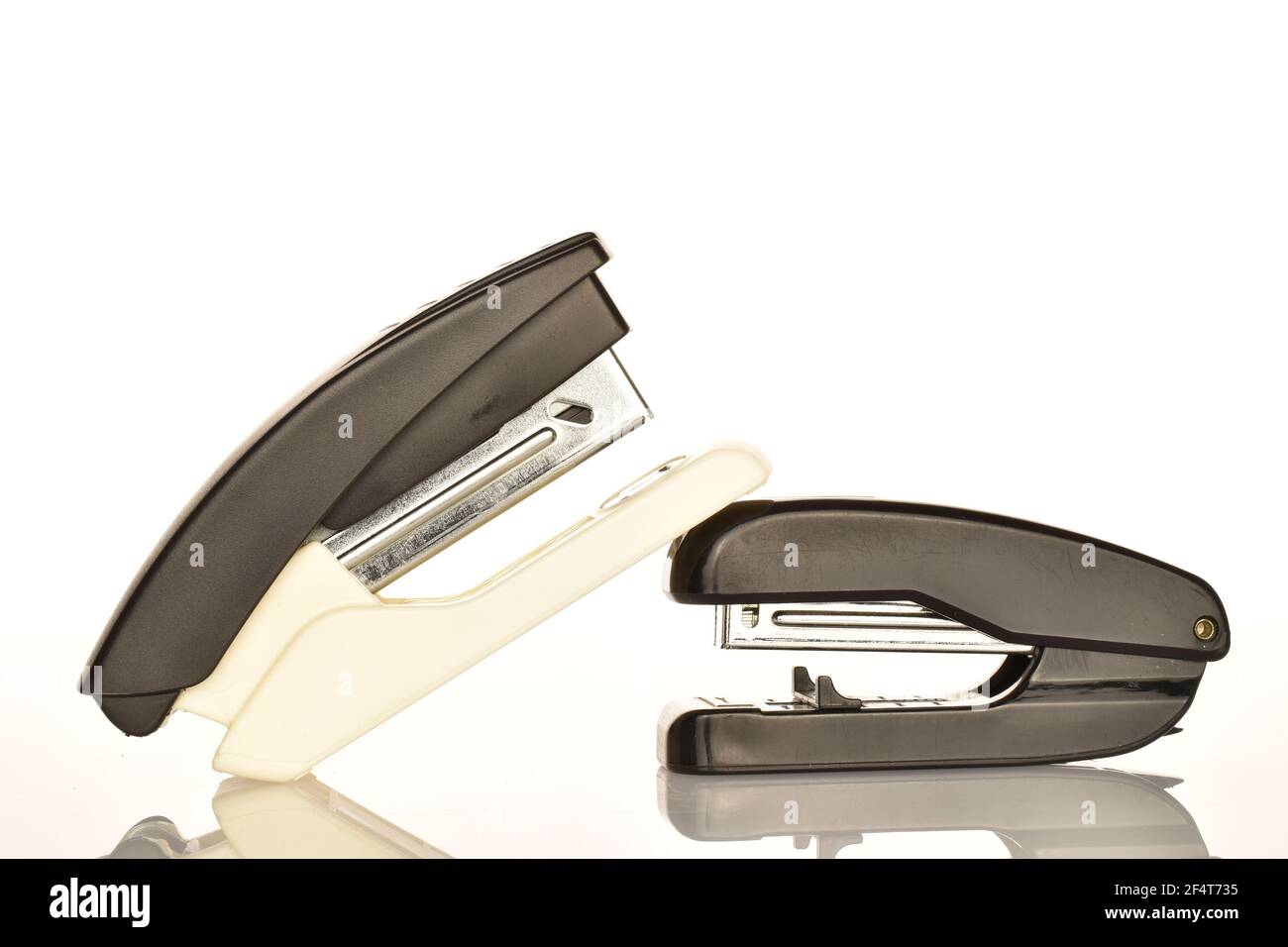 Two stationery staplers, macro, on a white background Stock Photo - Alamy