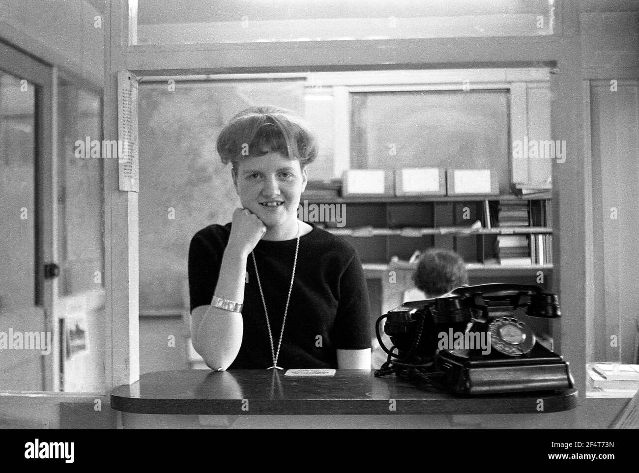 Woman female counter female employee Black and White Stock Photos ...