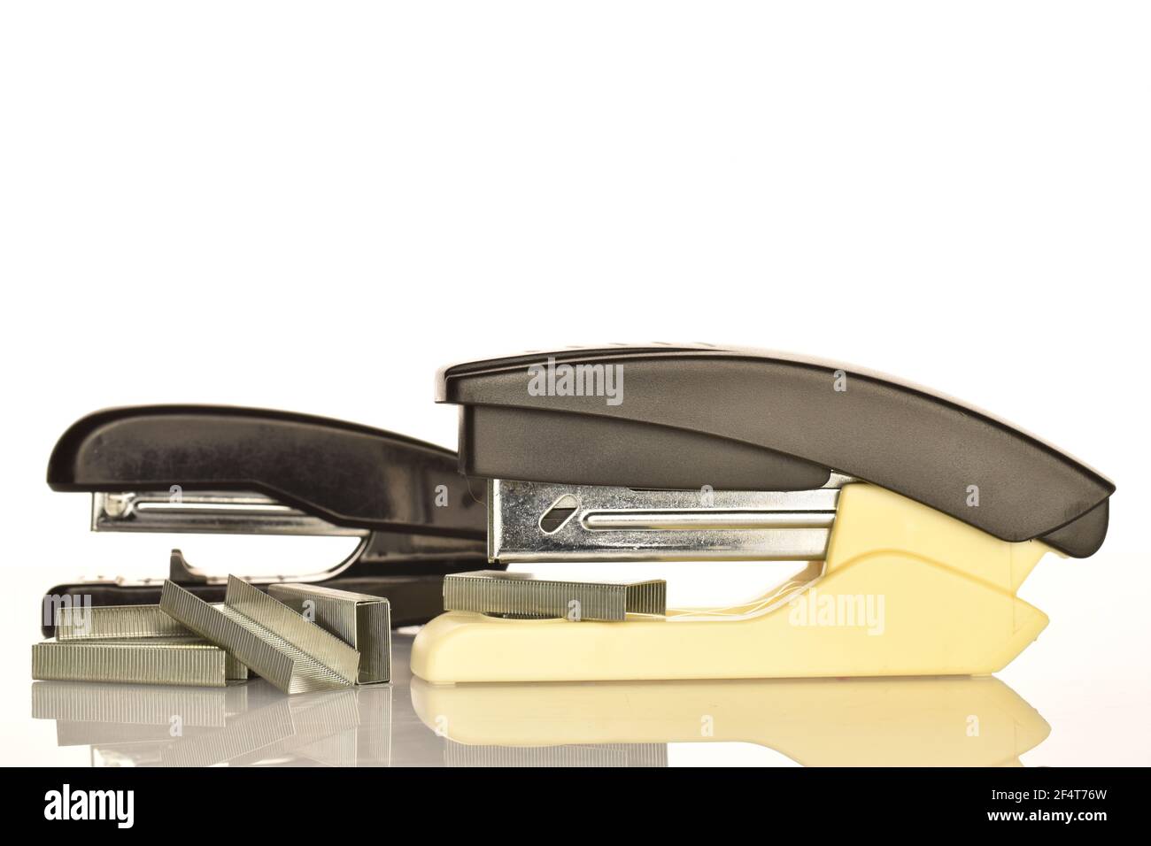 Two stationery staplers, macro, on a white background Stock Photo - Alamy