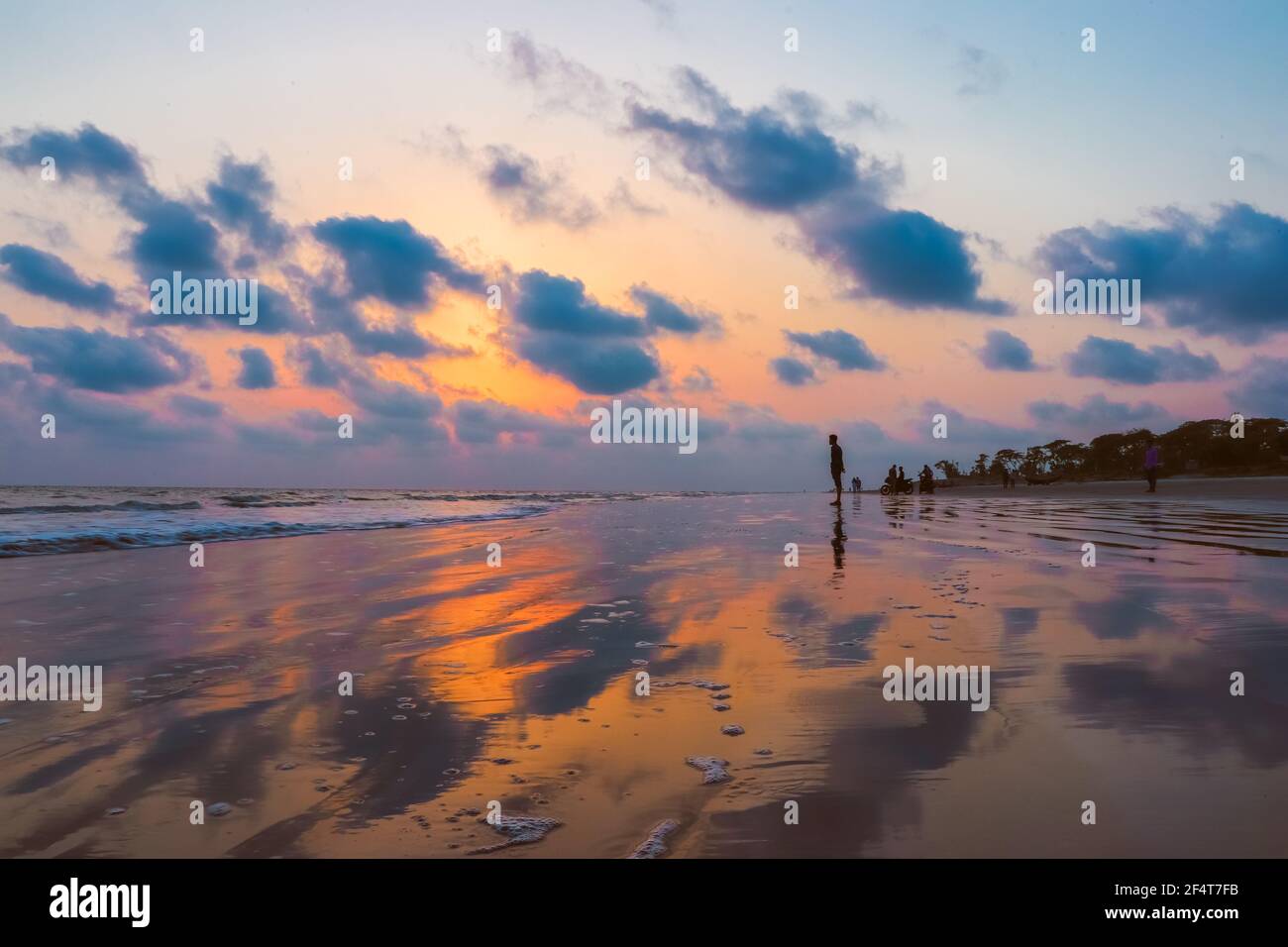 sunset landscape photo of Kuakata sea beach . evening sky reflected on ...