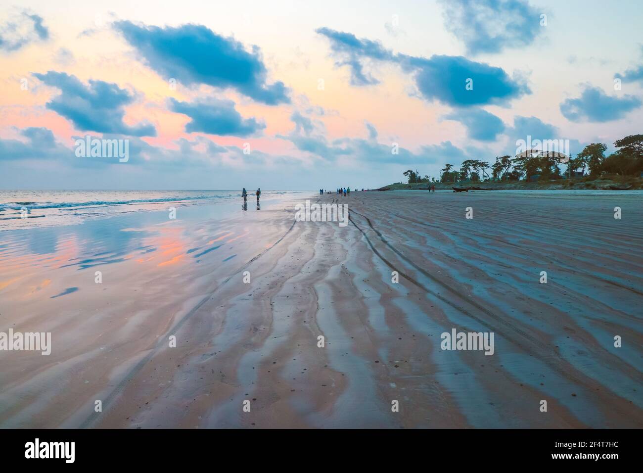 sunset landscape photo of Kuakata sea beach . evening sky reflected on ...
