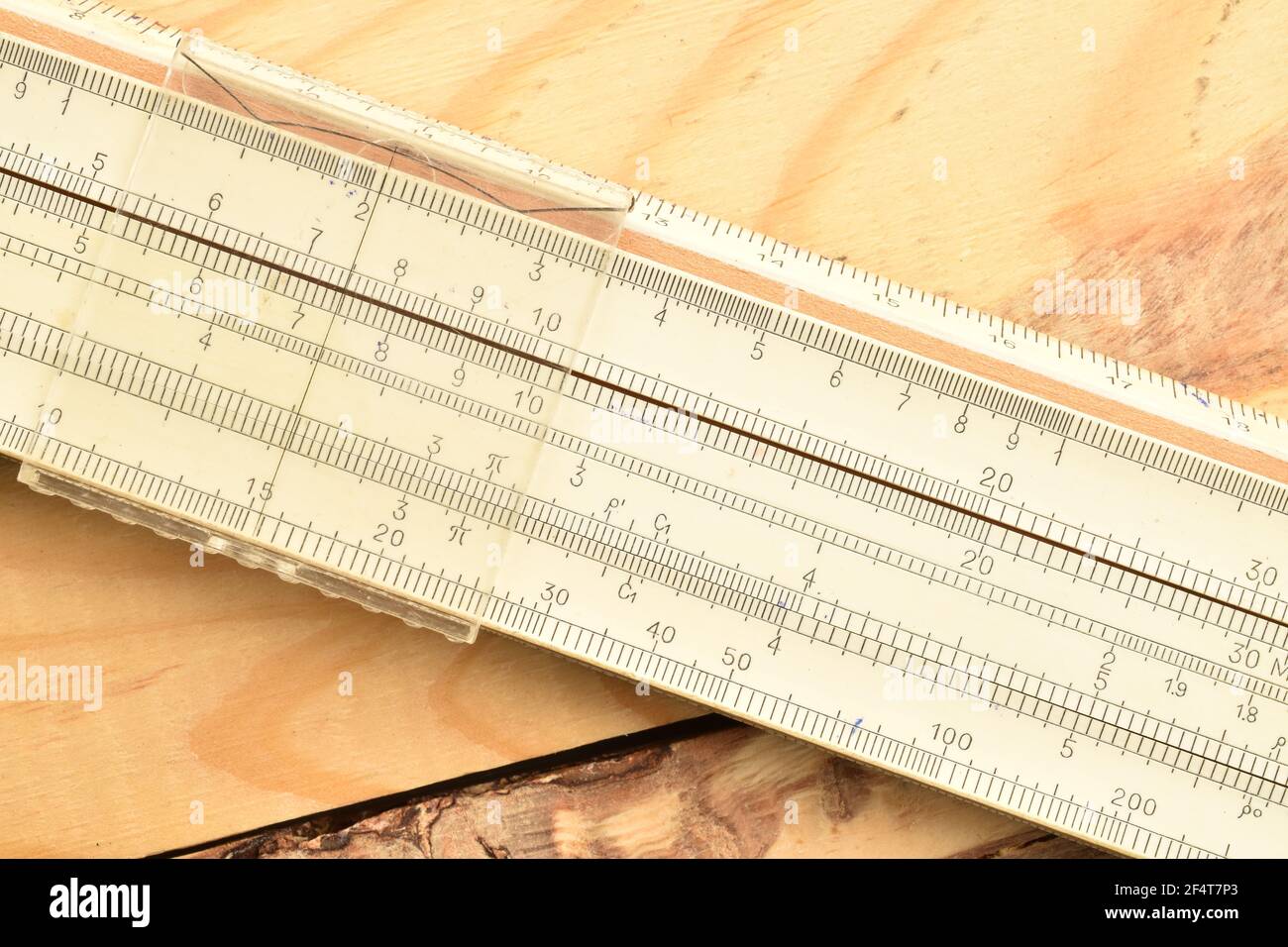Ruler for measuring distances on a wooden table Stock Photo - Alamy