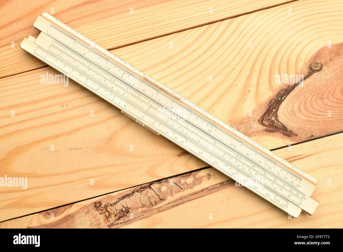 Ruler for measuring distances on a wooden table Stock Photo - Alamy