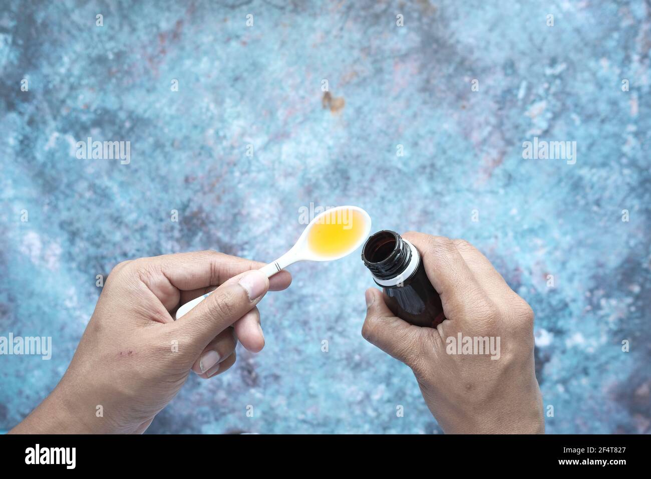 Taking medicine liquid hi-res stock photography and images - Alamy