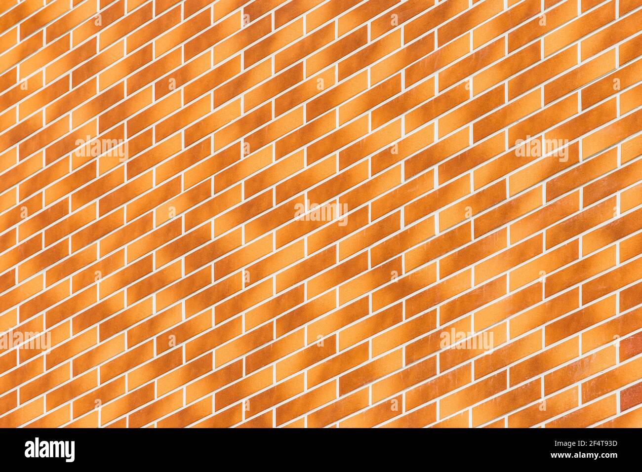 Diagonal, geometric modern light orange and brown brick wall building ...