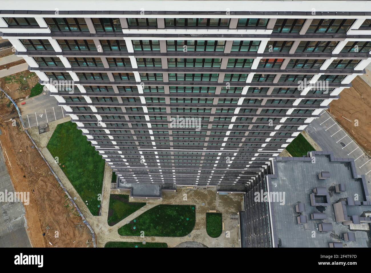 Beautiful multi-storey building standing on construction site top view ...
