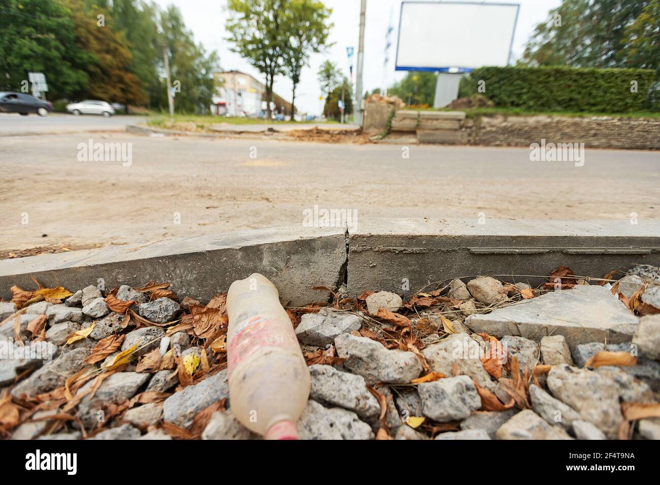 poorly executed road repairs. replacing the old curb stone with a new ...