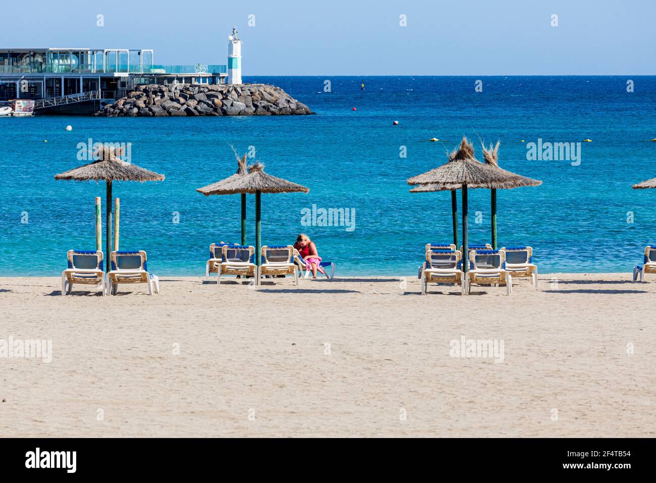 Playa del Castillo beach with straw umbrellas in Caleta de Fuste ...