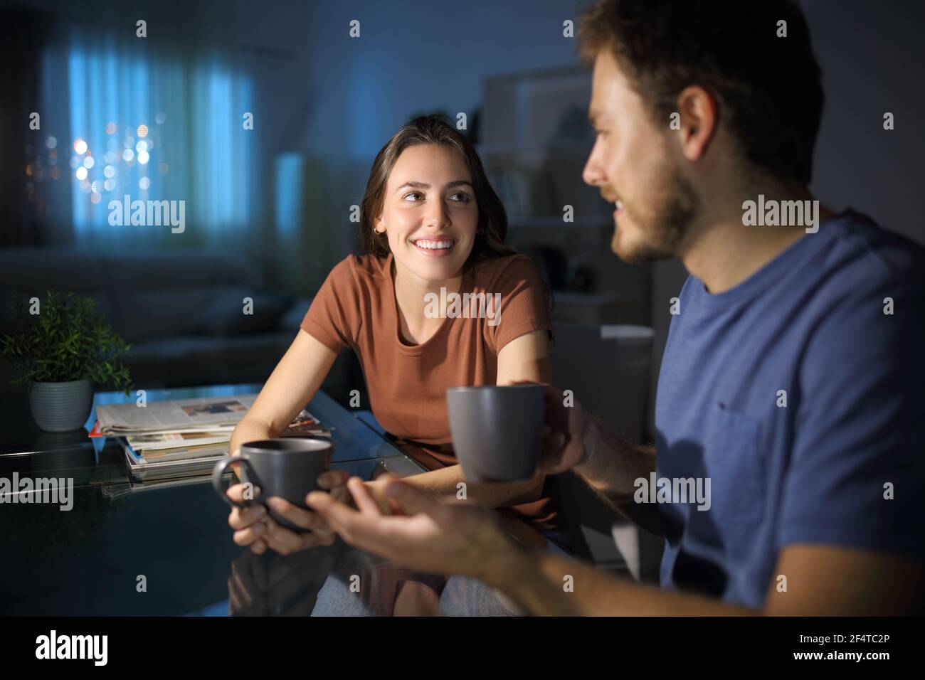 Young people talking in dark room hi-res stock photography and images ...