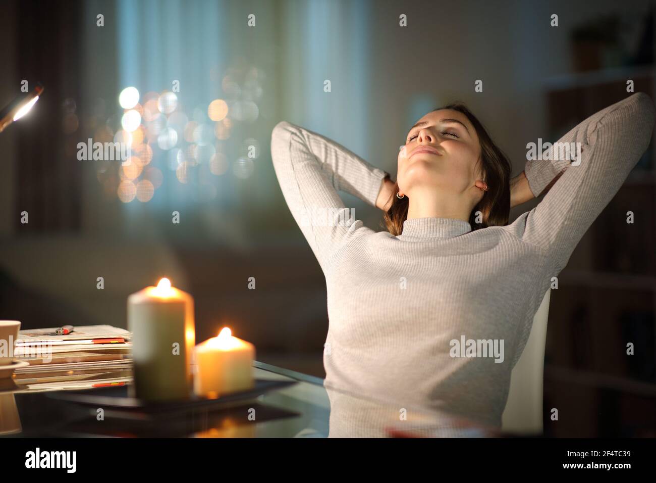 Woman sleeping in chair hi-res stock photography and images - Alamy
