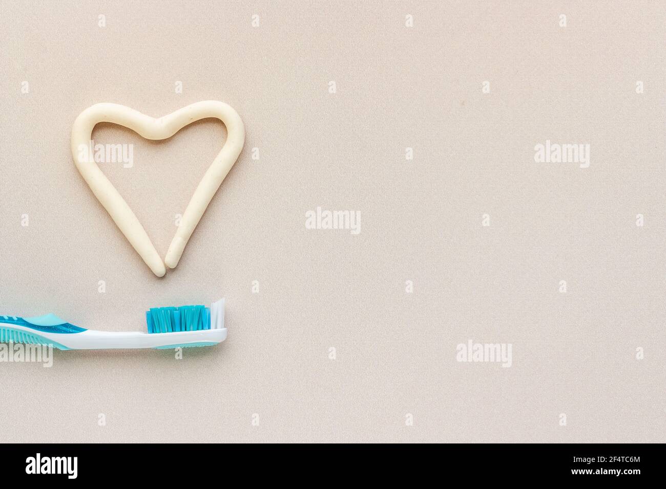 Heart shape of toothpaste with toothbrush, top view. Oral care and ...