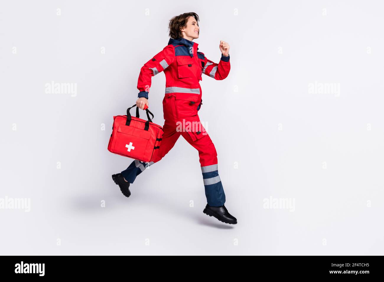 Full size profile side photo of happy smiling girl paramedic running in ...
