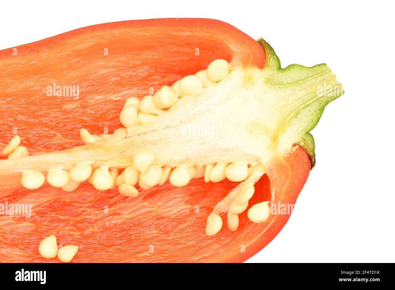 One half of fresh ripe tasty sweet red Kapia pepper on a white ...